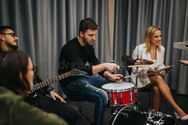 Musicians Rehearsing Together in Studio Preparing for an Upcoming ...