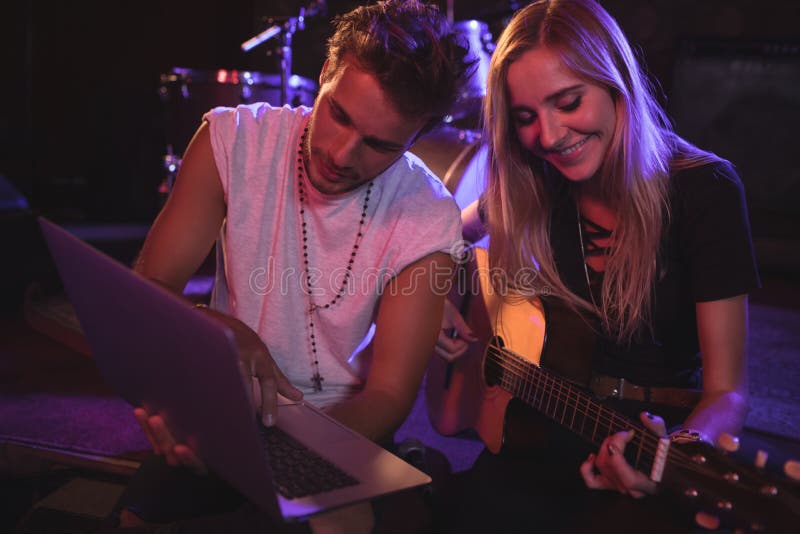 Musicians Using Laptop while Practicing in Nightclub Stock Photo ...