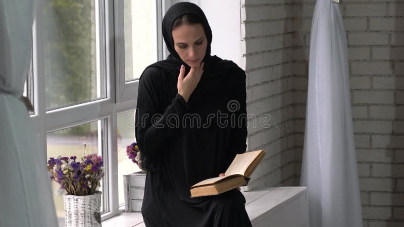 Muslim Arabic Female Reading Book at Home. Stock Video - Video of abaya ...