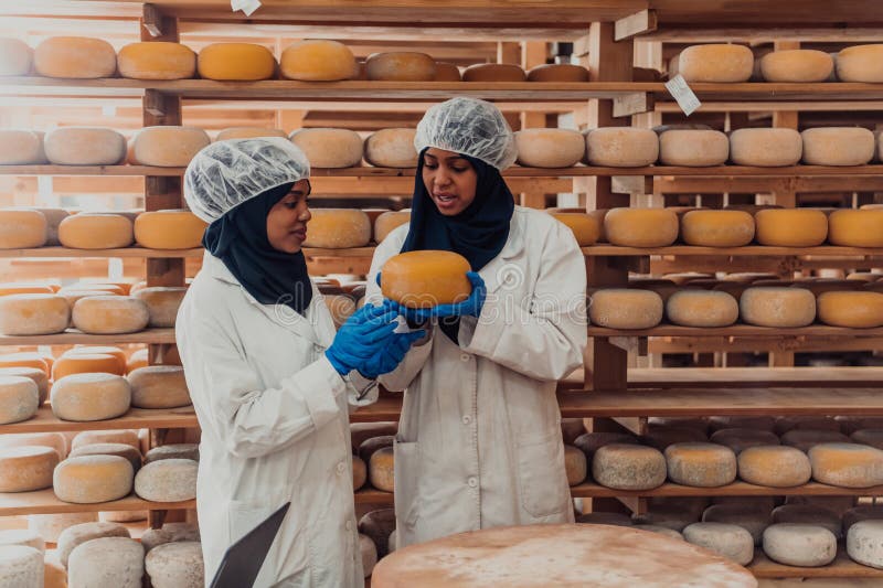 Muslim Business Partners Checking the Quality of Cheese in the Modern ...