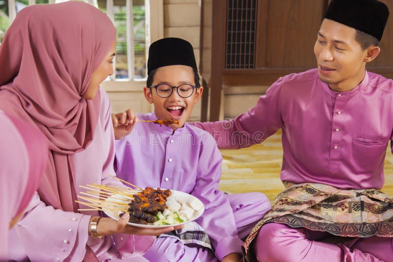 Muslim Family Feasting during the Eid Celebration Stock Photo - Image ...
