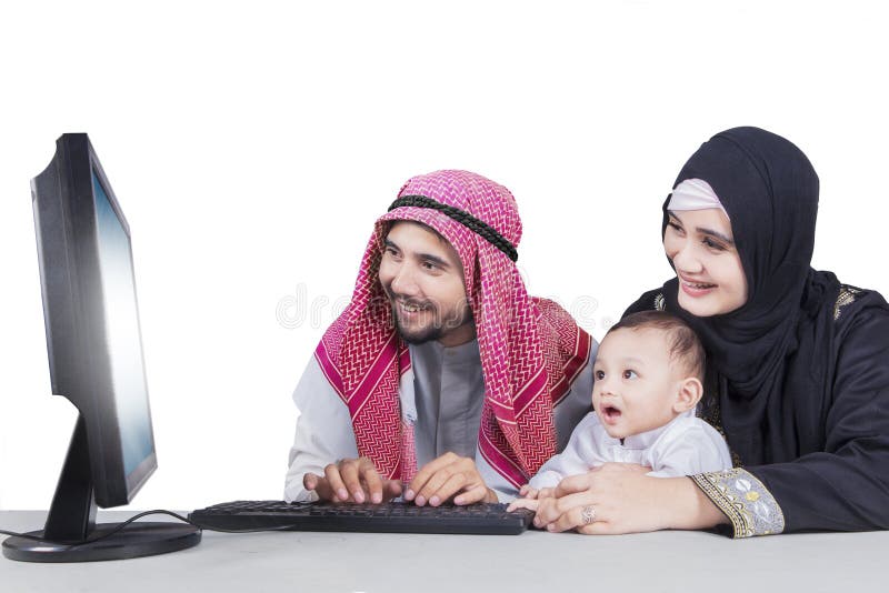 Muslim Family Using a Computer on Studio Stock Photo - Image of ...