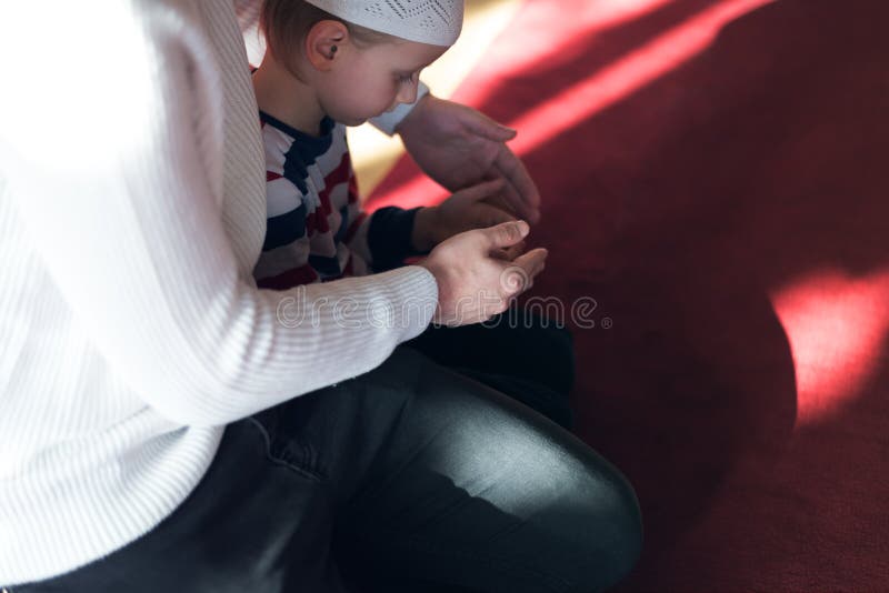 Muslim Father and Son Praying Together. Muslim Dad and Son Praying in ...