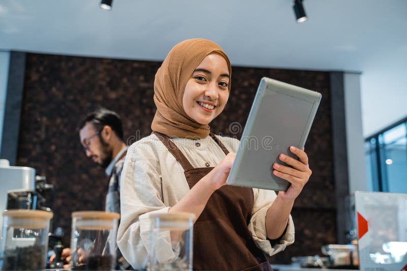 Muslim Female Cafe Owner Use Tablet while Working Stock Image - Image ...