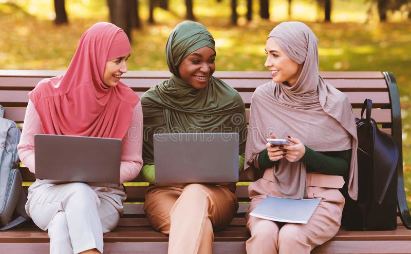 Muslim Female Students Using Laptops and Smartphone Learning Together ...