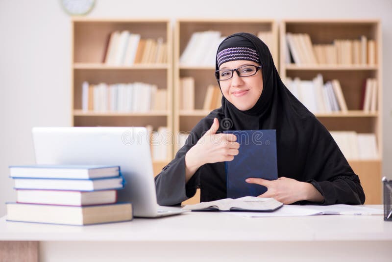 The Muslim Girl in Hijab Studying Preparing for Exams Stock Photo ...