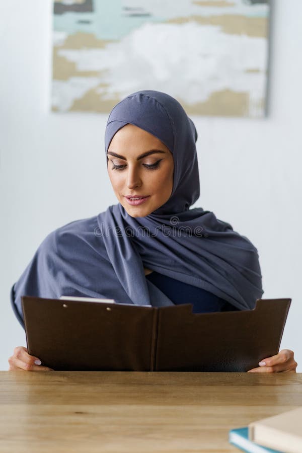 Muslim Girl Reading Documents Stock Image - Image of people, attention ...