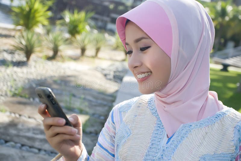 Muslim Girl are Using Handphone Stock Image - Image of diversity, islam ...