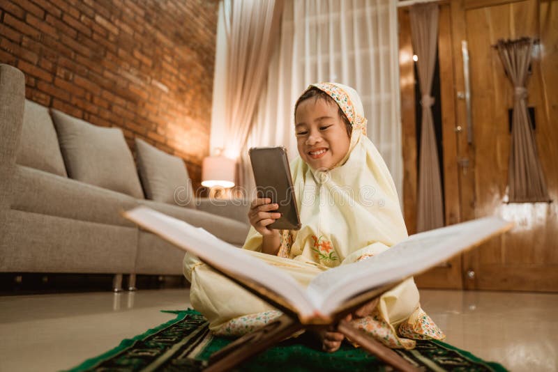 Muslim Kid Using Mobile Phone after Praying Stock Photo - Image of ...