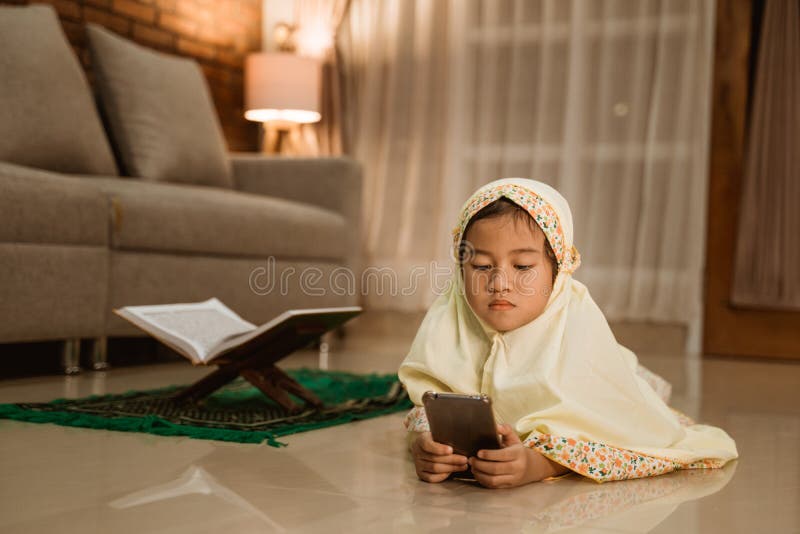 Muslim Kid Using Mobile Phone after Praying Stock Image - Image of ...