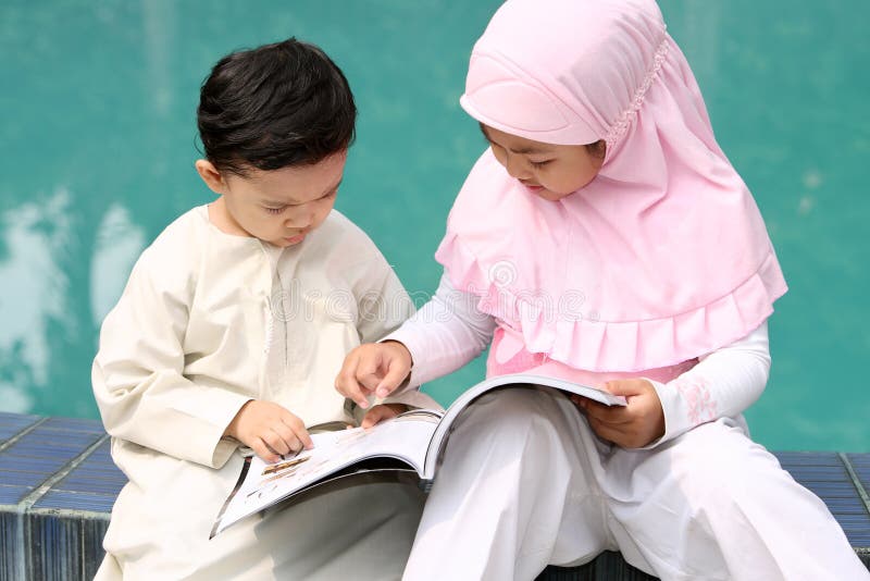 Muslim Kids Reading a Book stock photo. Image of beautiful - 6250564