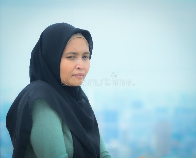 A Muslim Lady Poses in the Cafe on the Top of Building Stock Photo ...