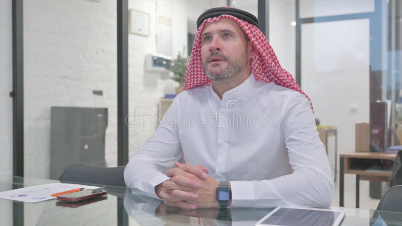 Muslim Man Checking Time on Watch while Waiting at Work Stock Footage ...