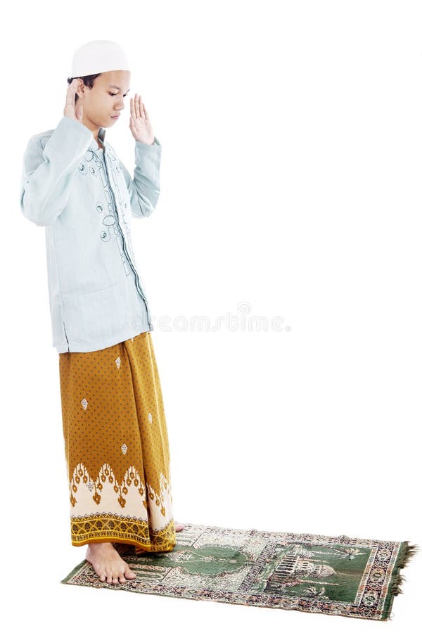 Muslim man praying on mat stock photo. Image of adult - 25877150