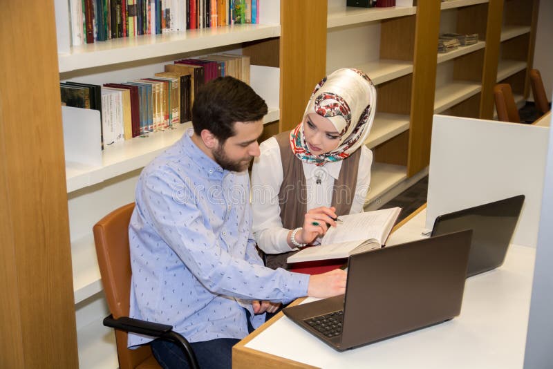 Muslim students in library stock image. Image of asian - 90373041