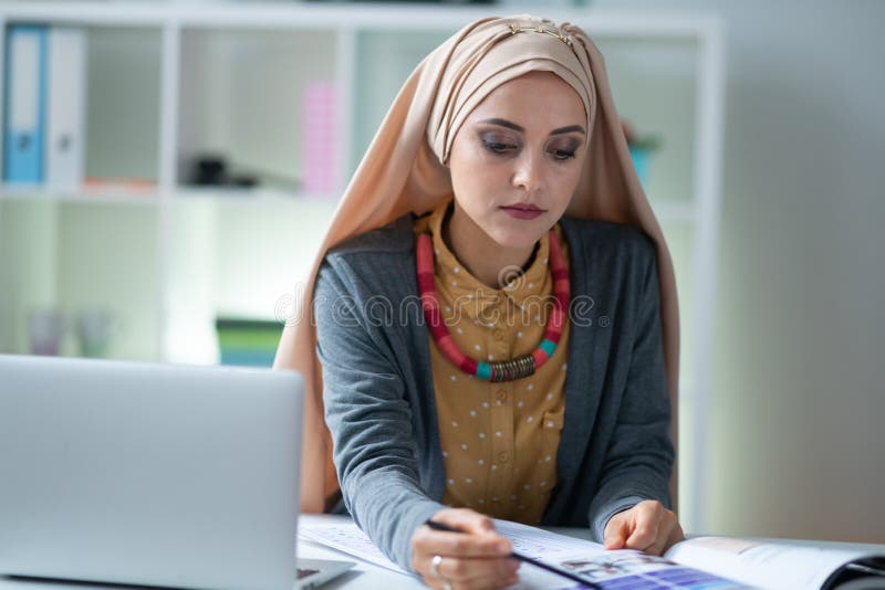 A Muslim Teacher Writes with Chalk a Blackboard. Stock Image - Image of ...