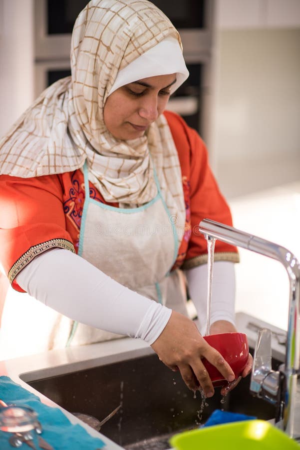 Muslim Traditional Woman Cleaning in Kitchen Stock Photo - Image of ...