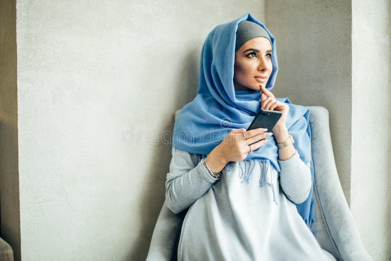 Muslim Woman Messaging on a Mobile Phone in Cafe Stock Image - Image of ...
