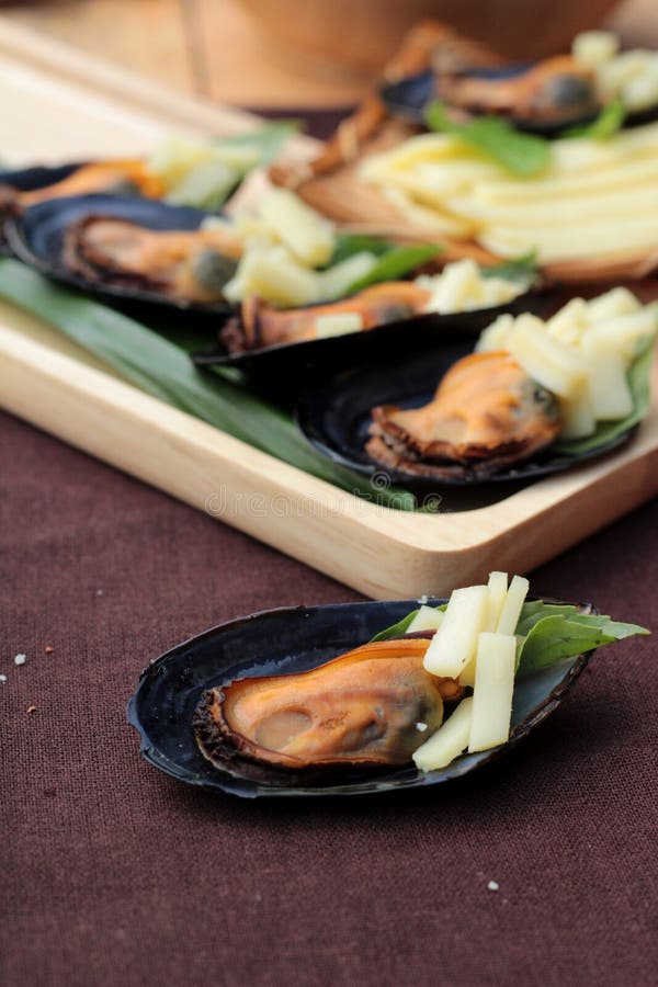 Mussel Bake, Sprinkle with Cheese is Delicious. Stock Photo - Image of ...