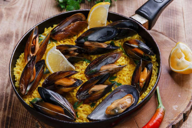 Mussel paella stock photo. Image of rice, seafood, rustic - 56395590