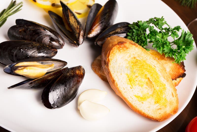 Mussels with fried bread stock image. Image of toast - 52751531
