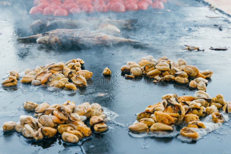 Mussels frying stock image. Image of flattop, steam, restaurant - 62818837