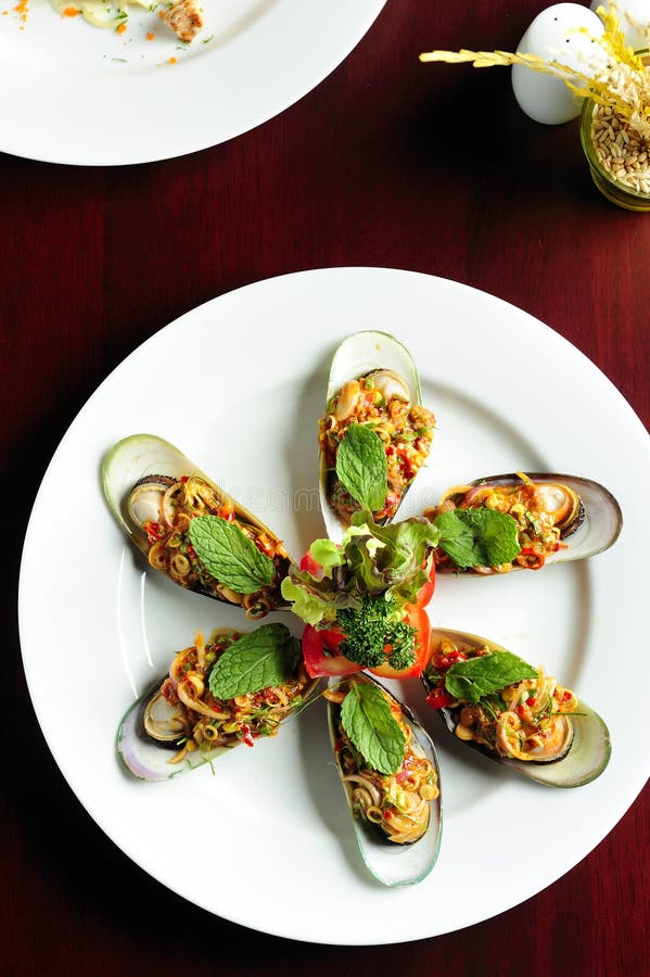 Mussels on white plate stock photo. Image of decoration - 24501254