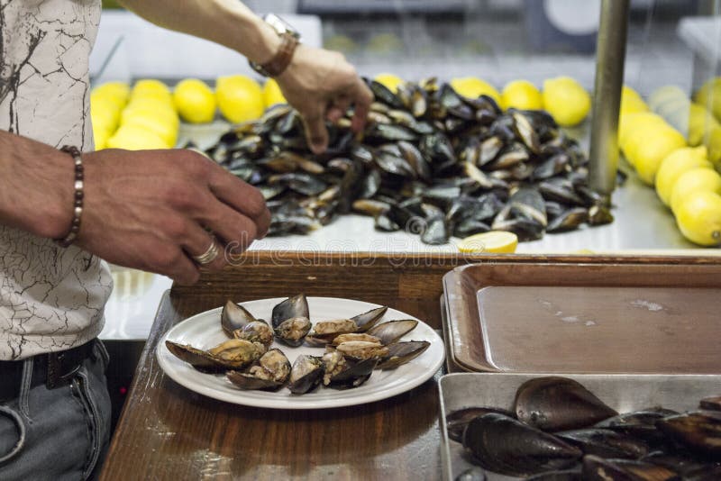 Mussle dealer working stock image. Image of macrophotography - 116396497
