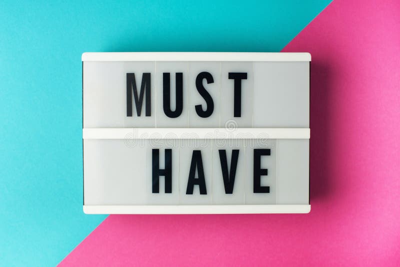 Must Have - Text on a Display Lightbox on Blue and Pink Background ...