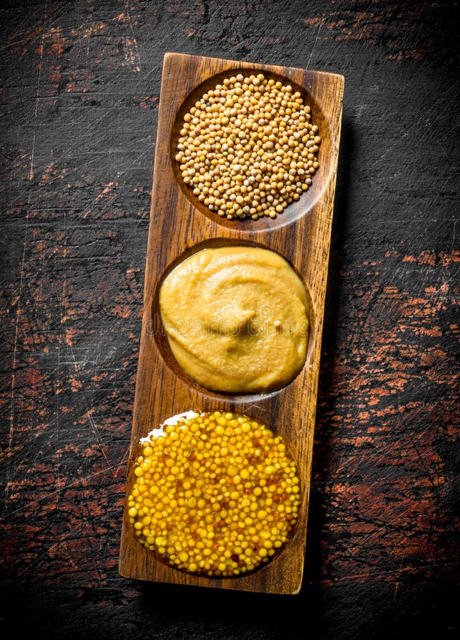 Mustard in a wooden stand stock photo. Image of brownish - 150501346