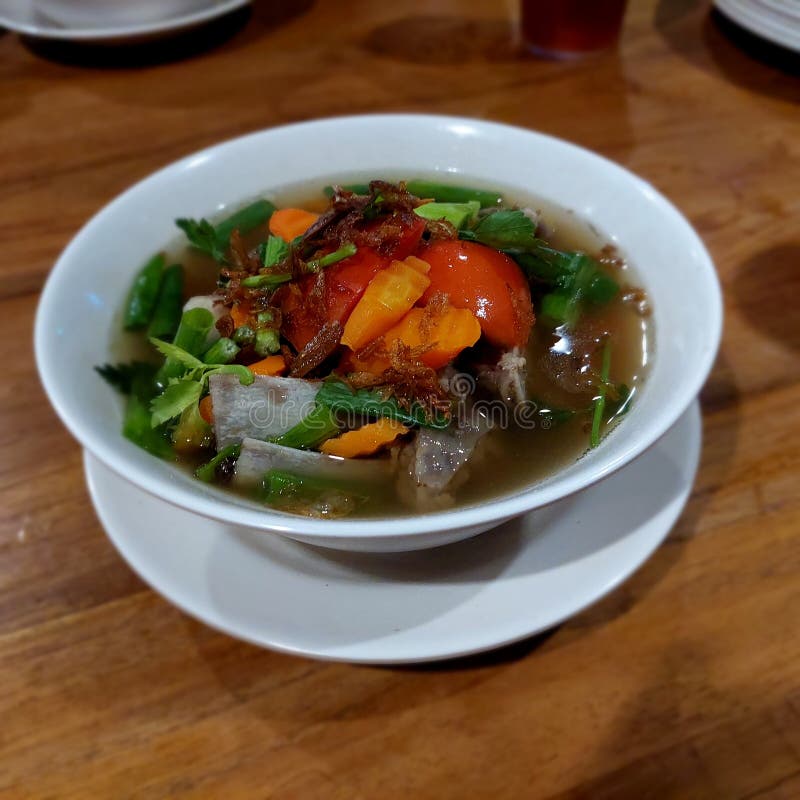 Mutton Ribs and Fat Served with Tomatoes and Celery, Cooked with Soup ...