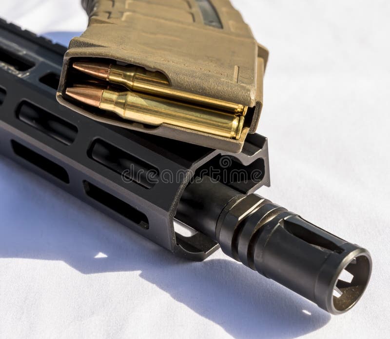 The Muzzle and Barrel of an AR 15 Rifle Underneath a Rifle Magazine ...