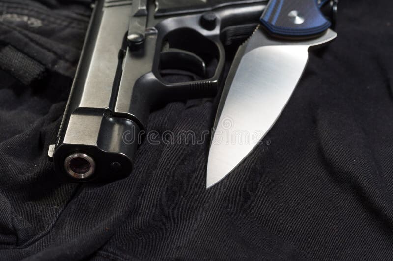 Muzzle Pistol and Knife Blade. Weapon Close-up Stock Image - Image of ...