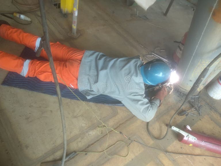 My Co-worker Was Welding in a Prone Position, Like a War Position Stock ...