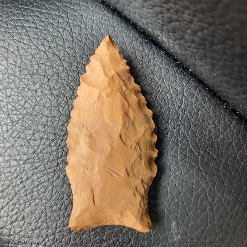 Arrowhead stock photo. Image of hand, circle, carving - 232807674