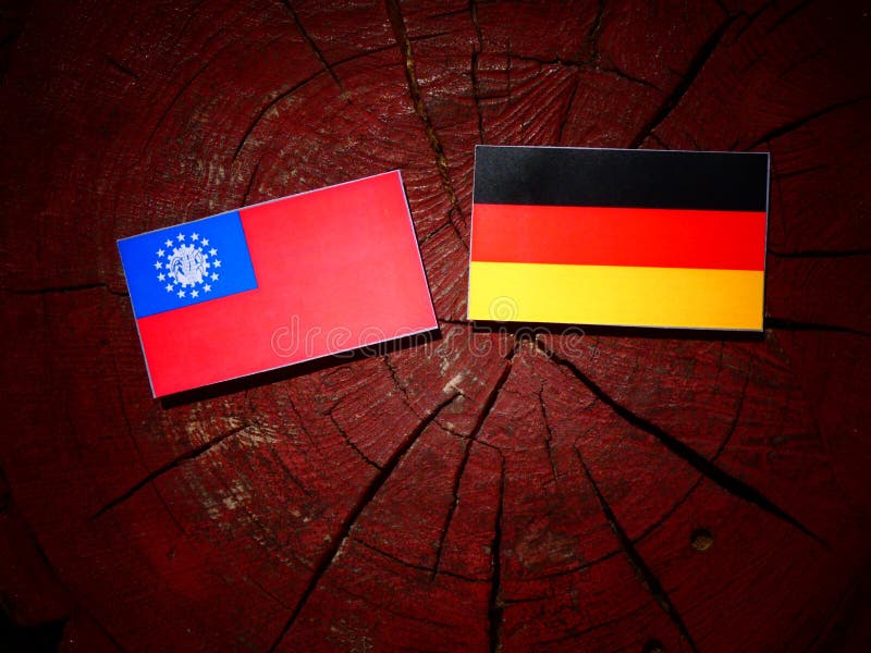 Myanmar Flag with German Flag on a Tree Stump Stock Image - Image of ...
