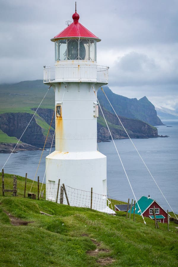 Mykines Lighthouse and Cliffs on Faroe Islands. Hiking Landmark Stock ...