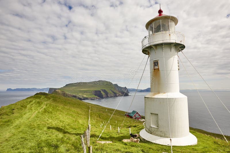 Mykines Lighthouse and Cliffs on Faroe Islands. Hiking Landmark Stock ...