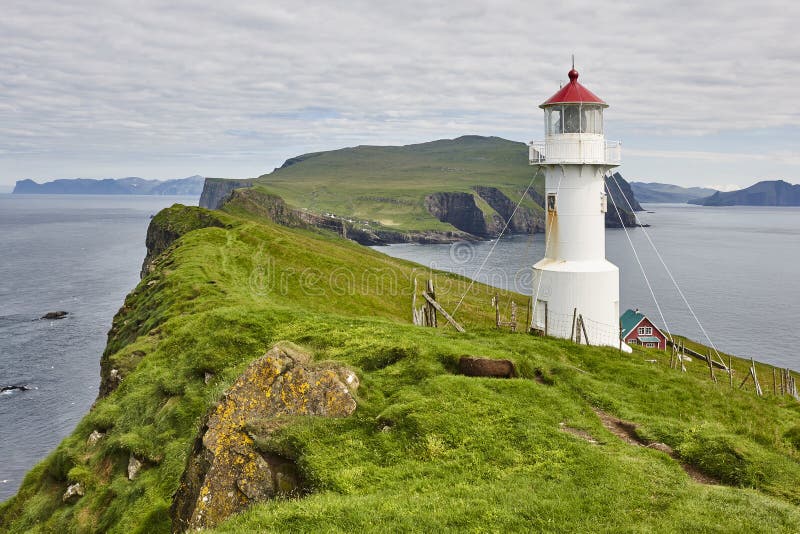 Mykines Lighthouse and Cliffs on Faroe Islands. Hiking Landmark Stock ...