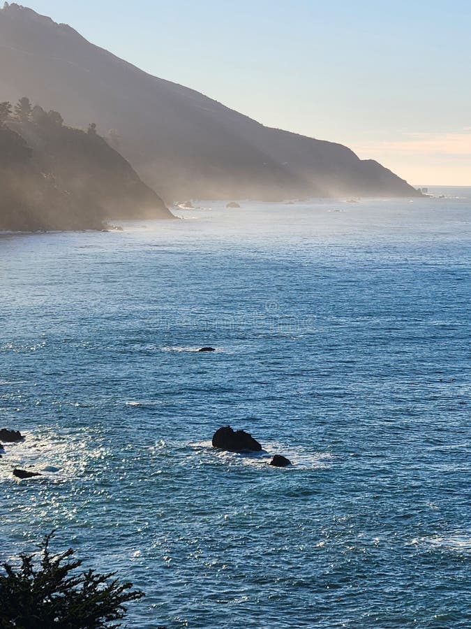 Mysterious Cliff Silhouettes Drop into the Ocean Stock Image - Image of ...