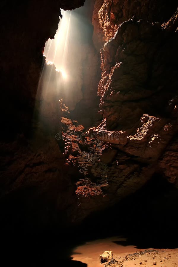 Mysterious light in a cave stock image. Image of geological - 100557721
