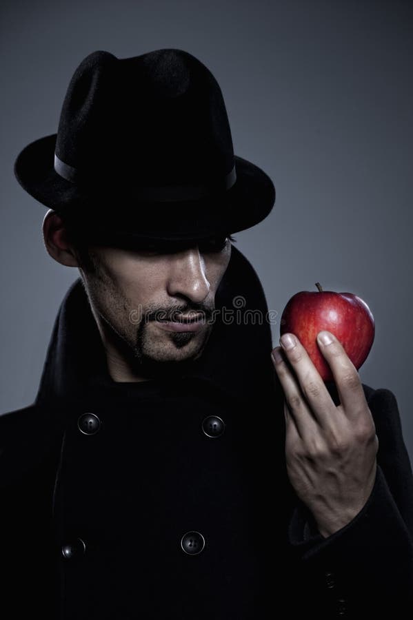 Mysterious Man Holding an Apple Stock Photo - Image of masculine, fruit ...