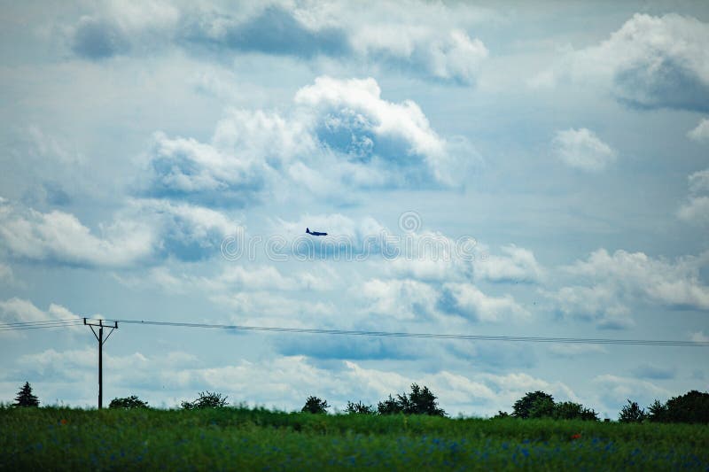 A Mysterious Object Has Been Spotted in the Sky Above the Green Fields ...