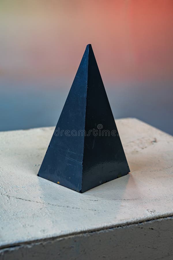 Mysterious Pyramid: Play of Light and Shadow on Matte Black Stone Stock ...