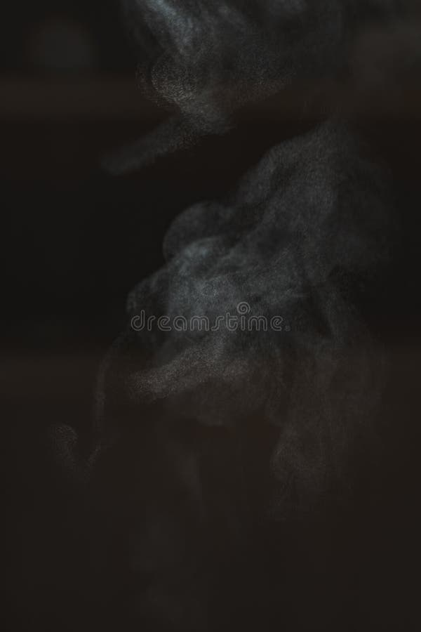 Translucent Smoke Patterns Flowing Gracefully Against Dark Background ...