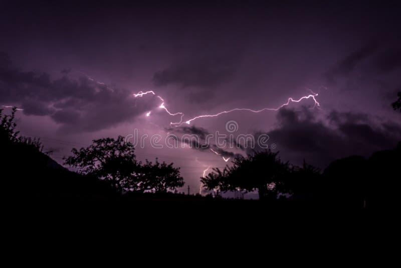 Mysterious View of a Lightning in a Purple Night Sky Stock Image ...
