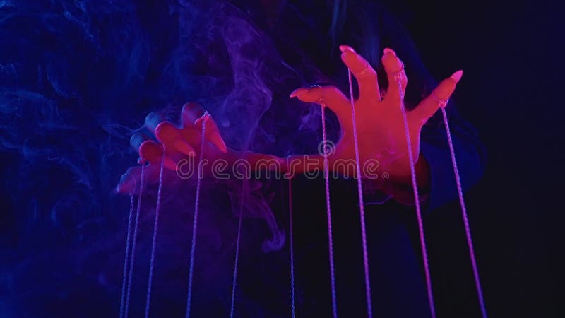 Mystical Hands Controlling Strings in a Smoky Atmosphere Stock Video ...