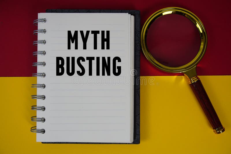 Myth Busting Text Written on Notebook Paper with Magnifying Glass Stock ...