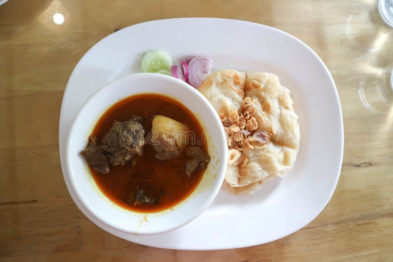 Naan Bread or Roti with Curry Soup or Beef Stewed Stock Photo - Image ...