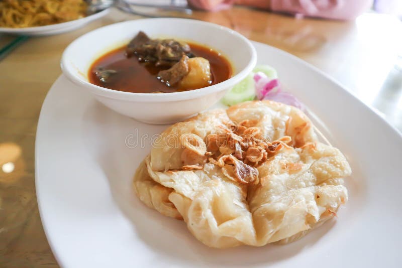 Naan Bread or Roti with Curry Soup or Beef Stewed Stock Image - Image ...